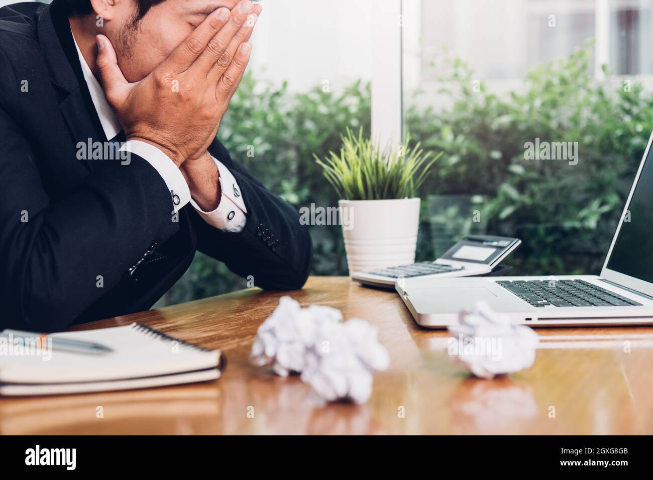 Asian young business man tired strain failure on he work in desk table ...