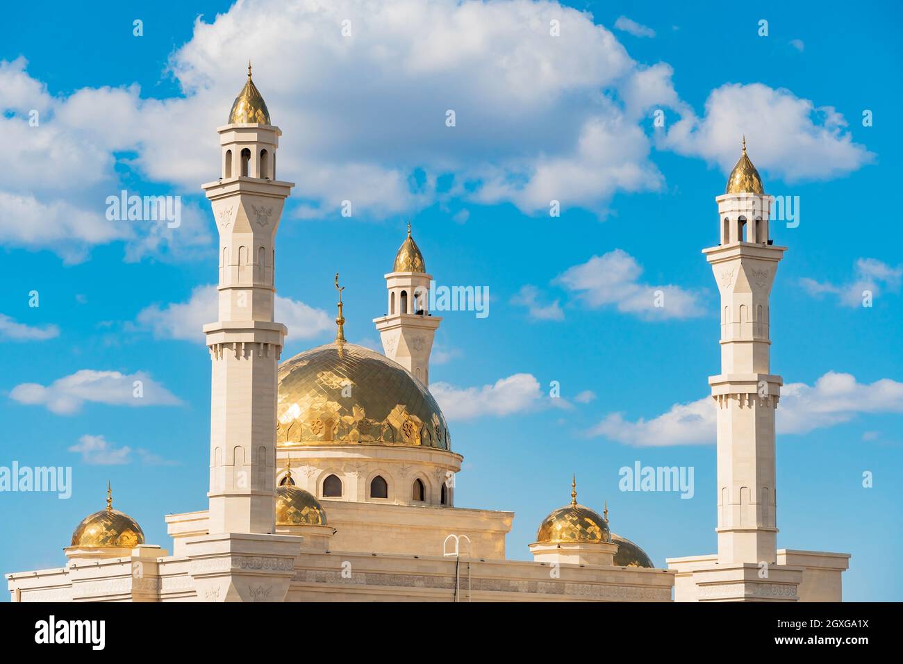A Muslim Islamic mosque with golden minarets and a crescent moon ...