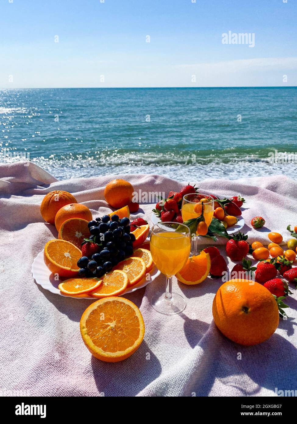 fresh fruit at the beach. Fruits in the sun. Summer time beach concept ...
