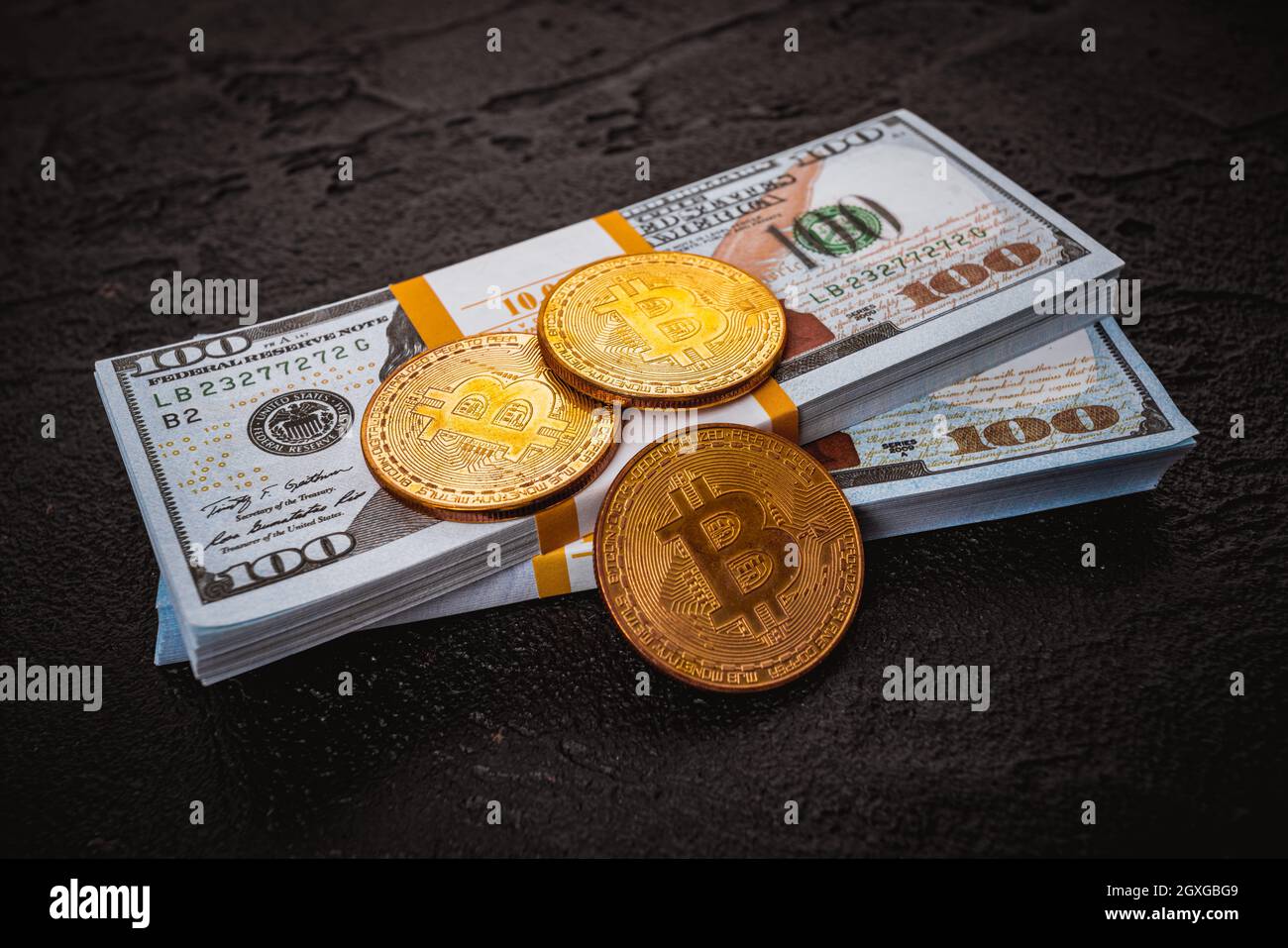 golden bitcoin metal coin on one US dollar bill Stock Photo - Alamy