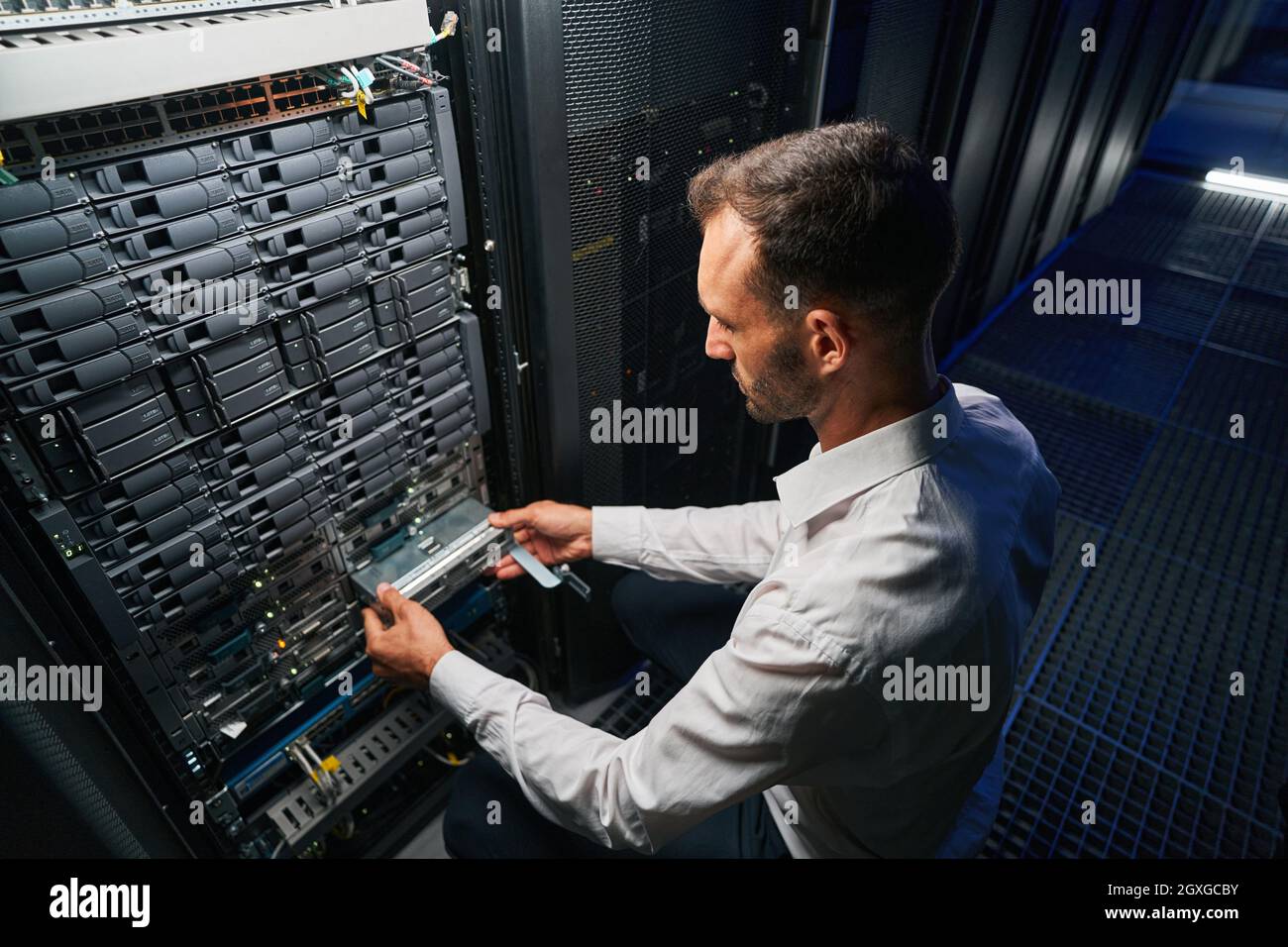 Professional it specialist working in data center Stock Photo - Alamy