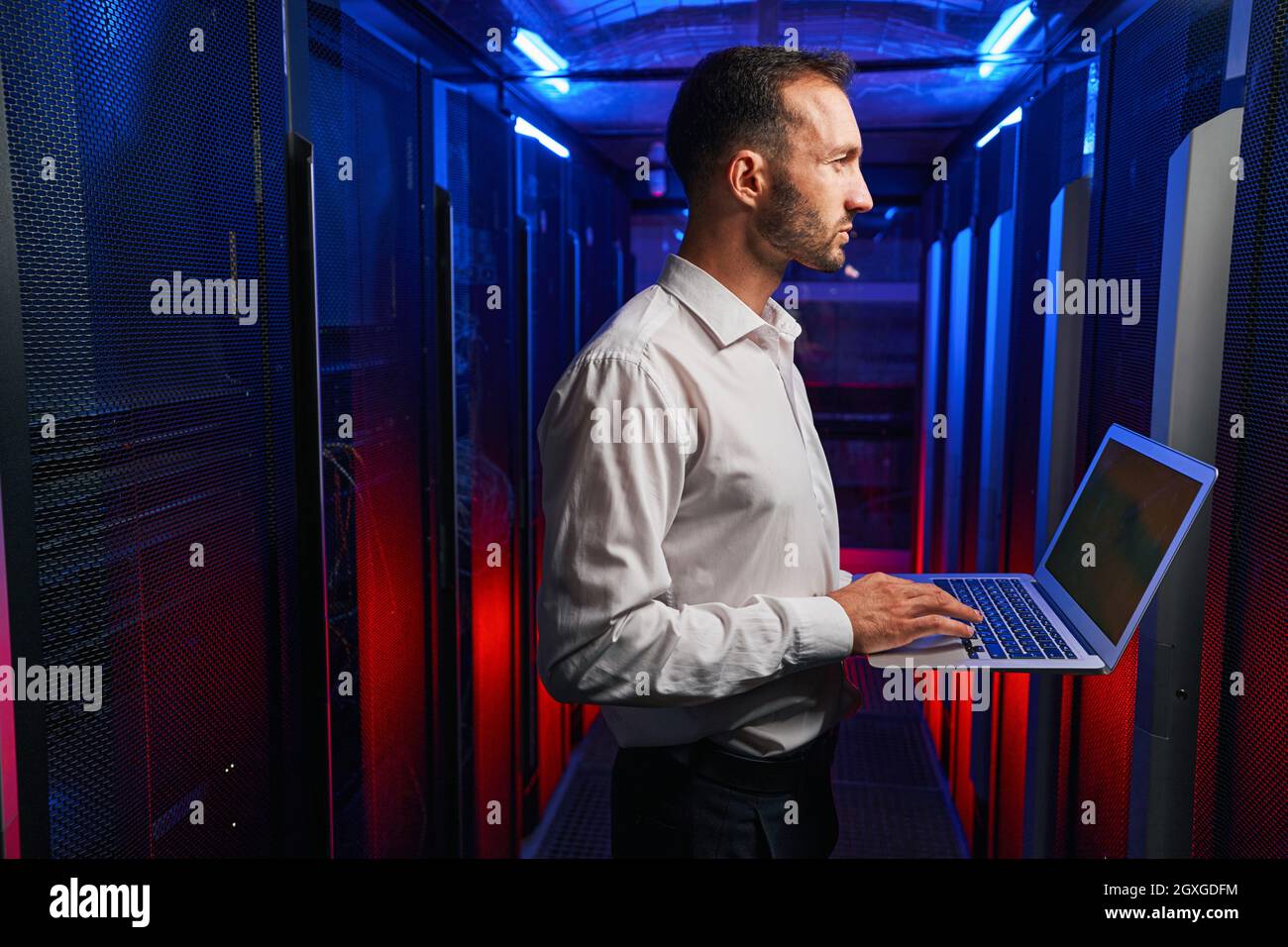 Bearded concentrated professional it specialist working with ...