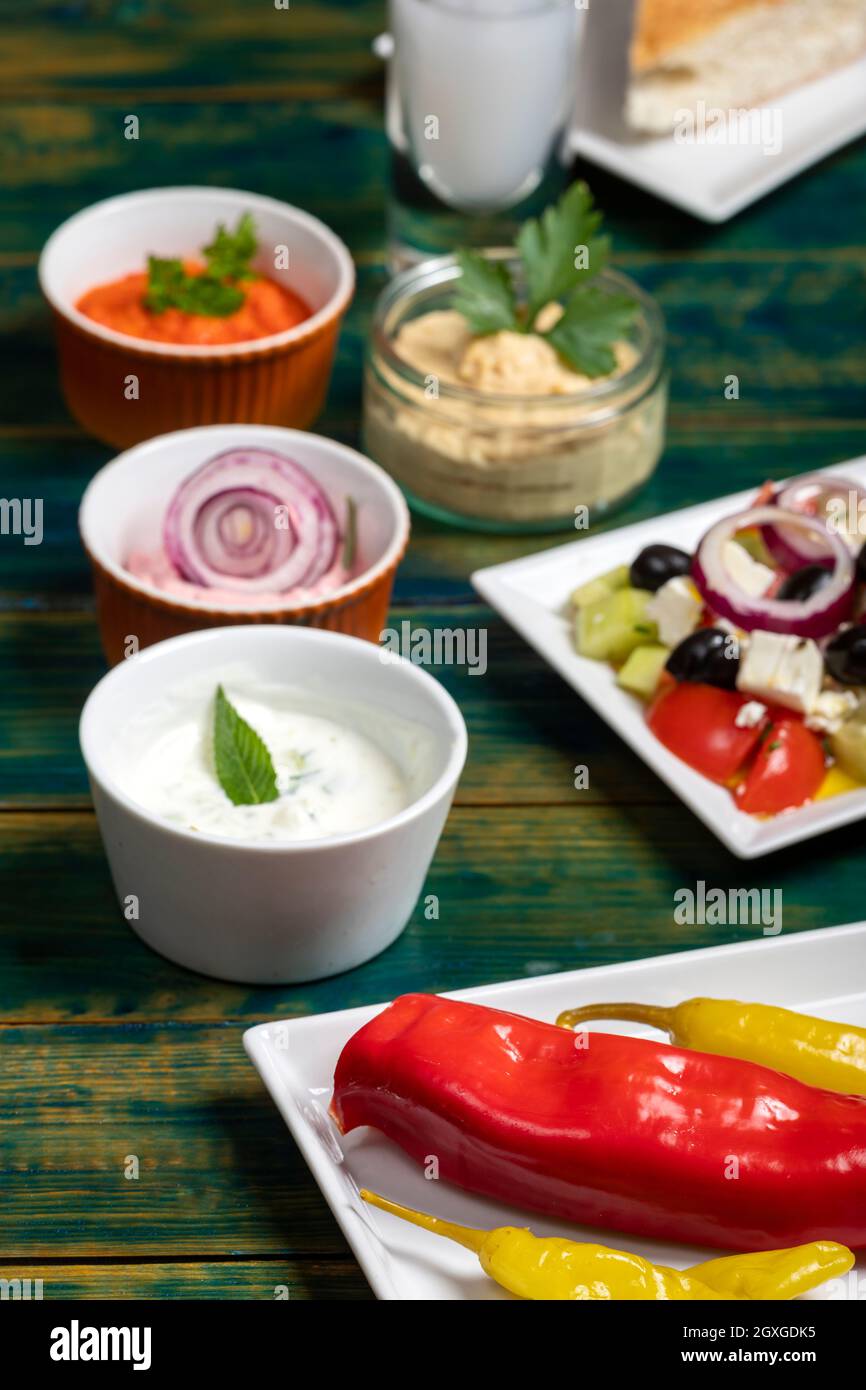 greek starter on green wood Stock Photo - Alamy