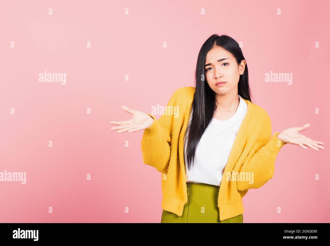 Asian portrait beautiful cute young woman teen shrugging with spread ...
