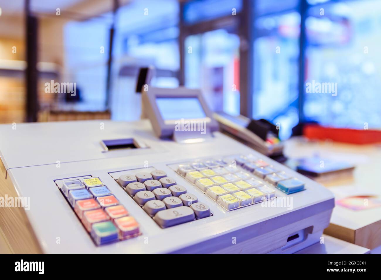 Cash register in a shop: Customer is paying purchase Stock Photo - Alamy