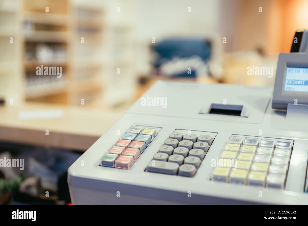 Cash register in a shop: Customer is paying purchase Stock Photo - Alamy