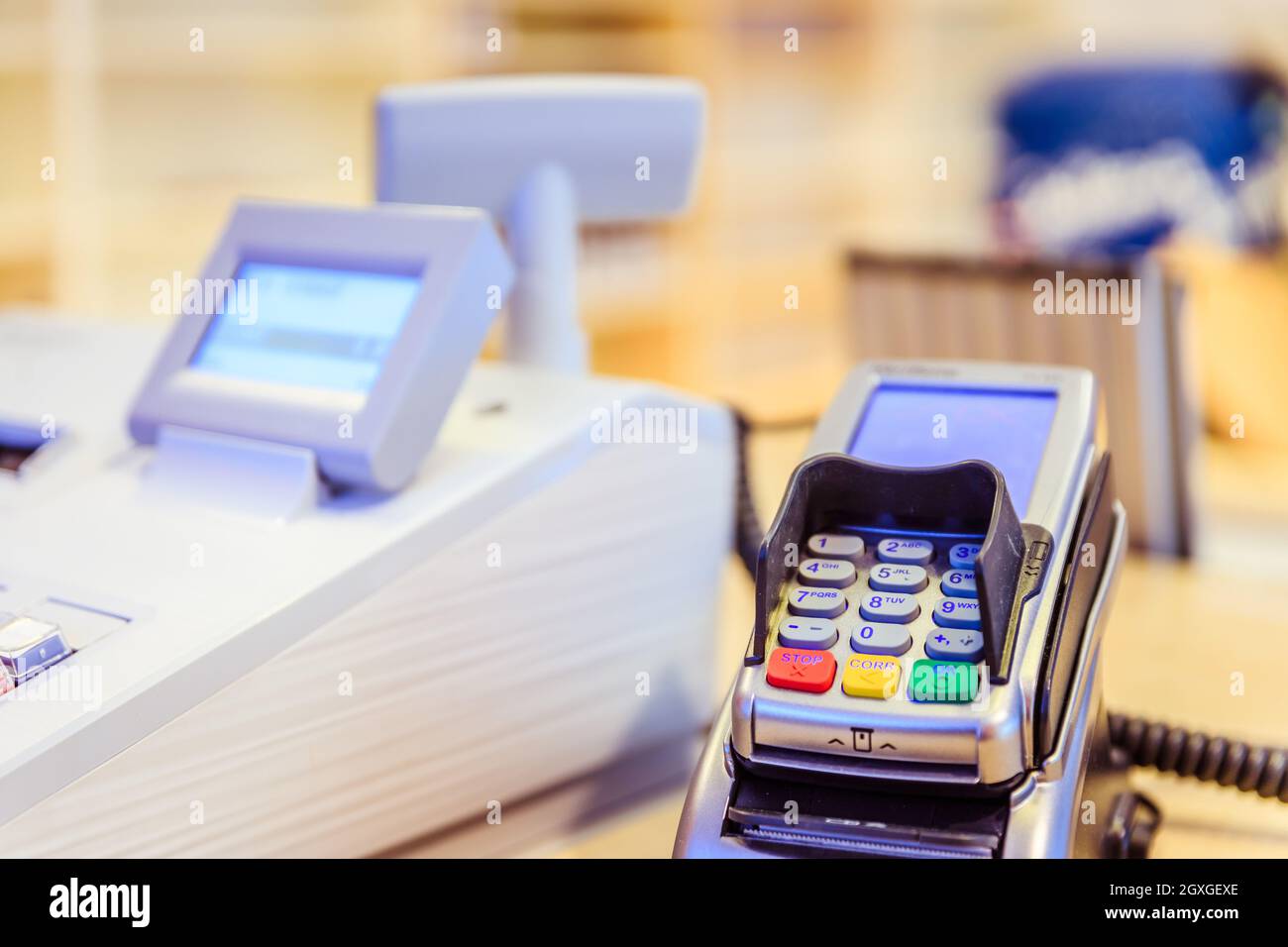 Cash register in a shop: Customer is paying purchase Stock Photo - Alamy