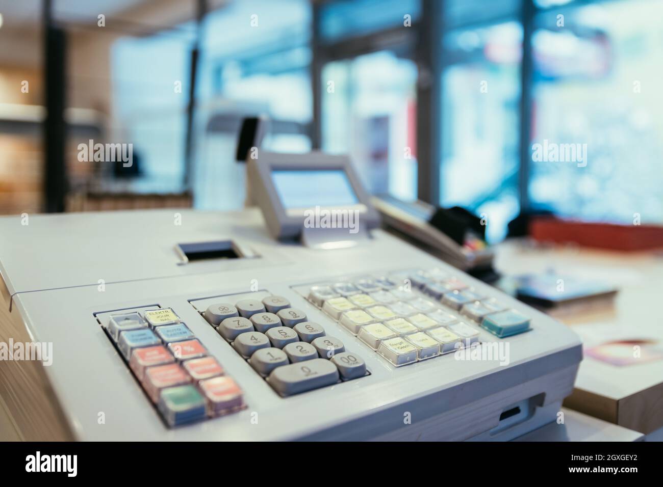 Cash register in a shop: Customer is paying purchase Stock Photo - Alamy