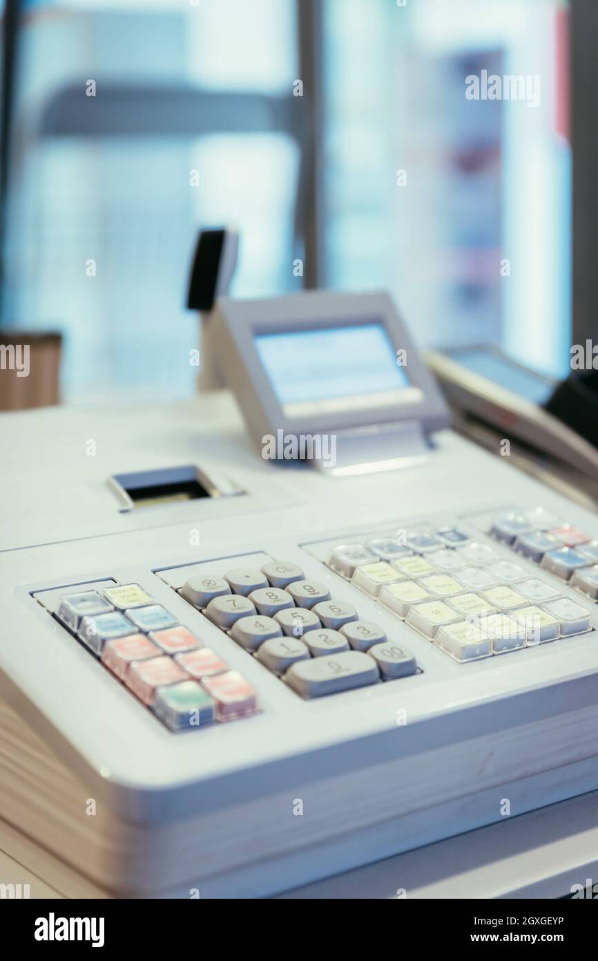 Cash register in a shop: Customer is paying purchase Stock Photo - Alamy