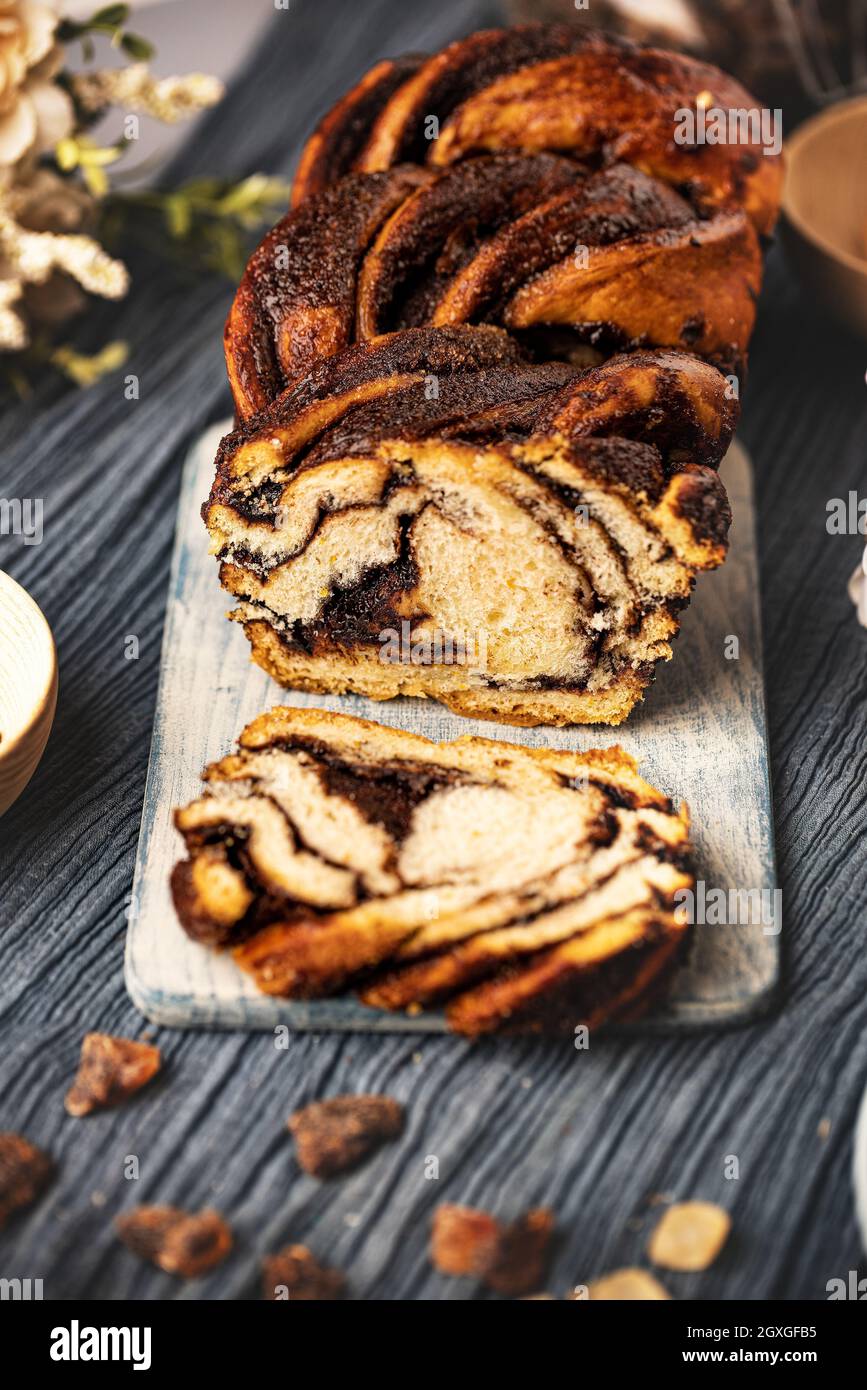 Traditional Polish babka cake with chocolate on wooden cutting board ...