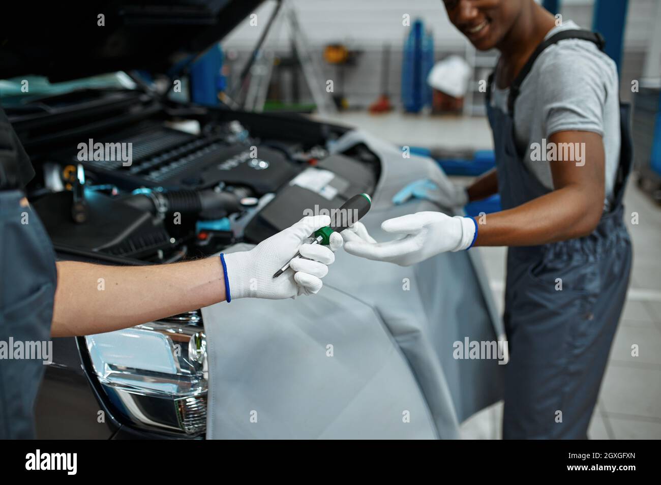 Male working car engine transportation automotive repairs hi-res stock ...