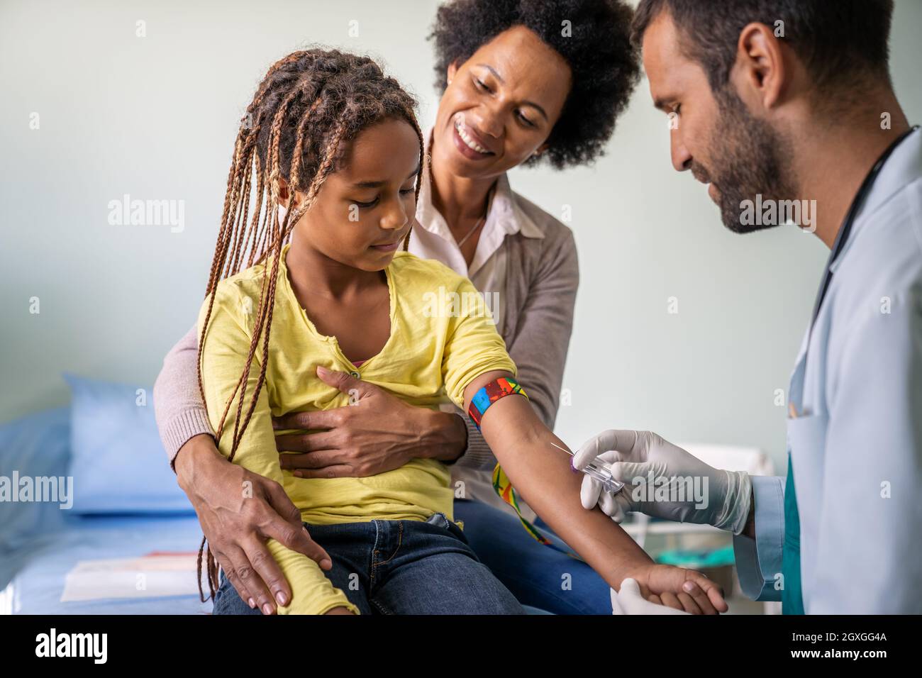 Pediatrician takes blood from a child patient. Healthcare antibody test ...