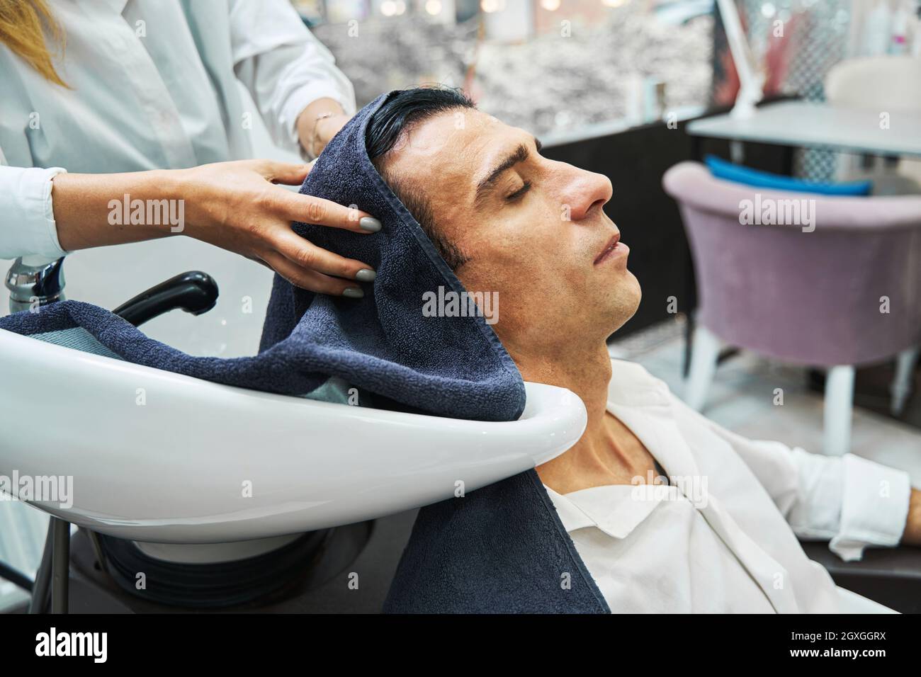 Hairdressed drying man head with towel after washing Stock Photo - Alamy