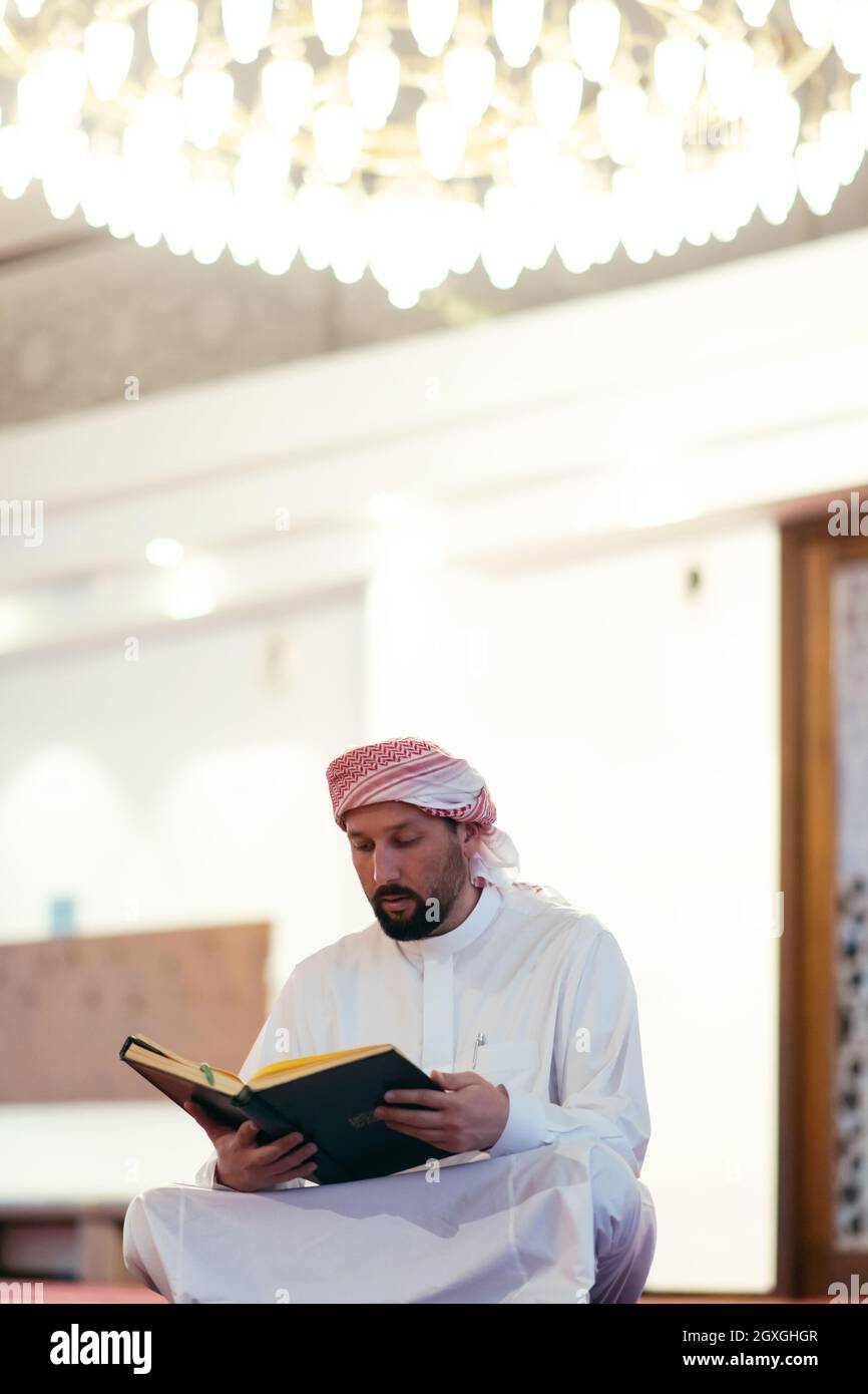 muslim man praying Allah alone inside the mosque and reading islamic ...