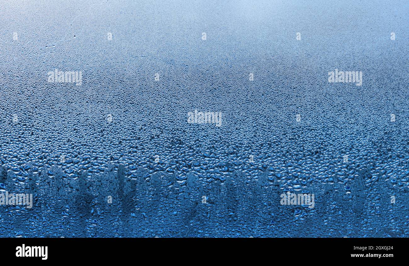 Misted glass in the house. The texture of water drops on the glass ...