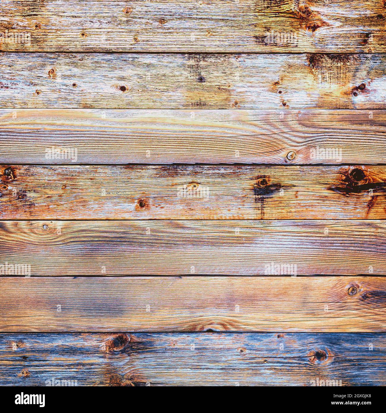 Texture of the planks of an old wooden table in antiqued pastel colors ...