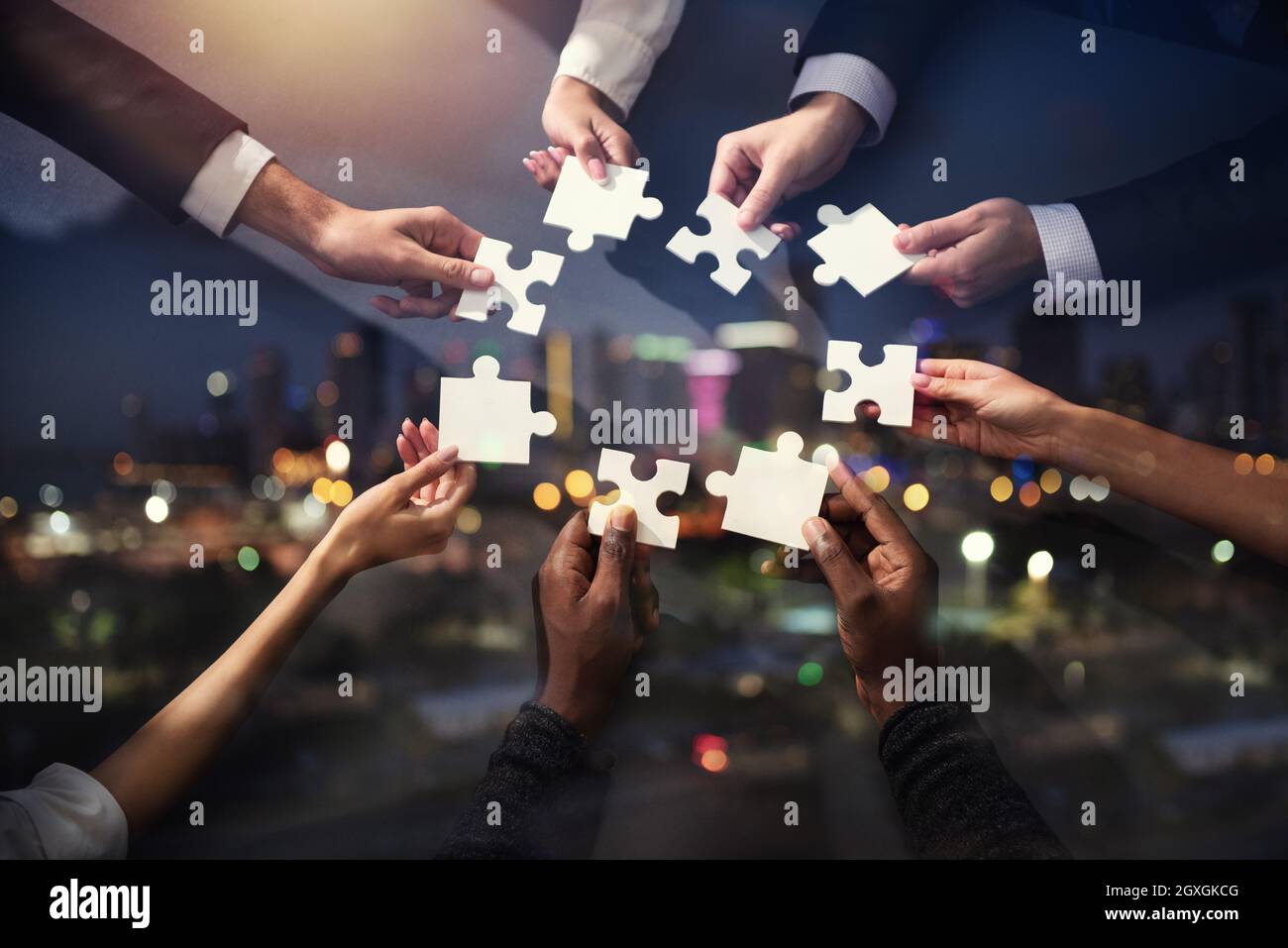 Businessmen working together to build a puzzle. Concept of teamwork ...