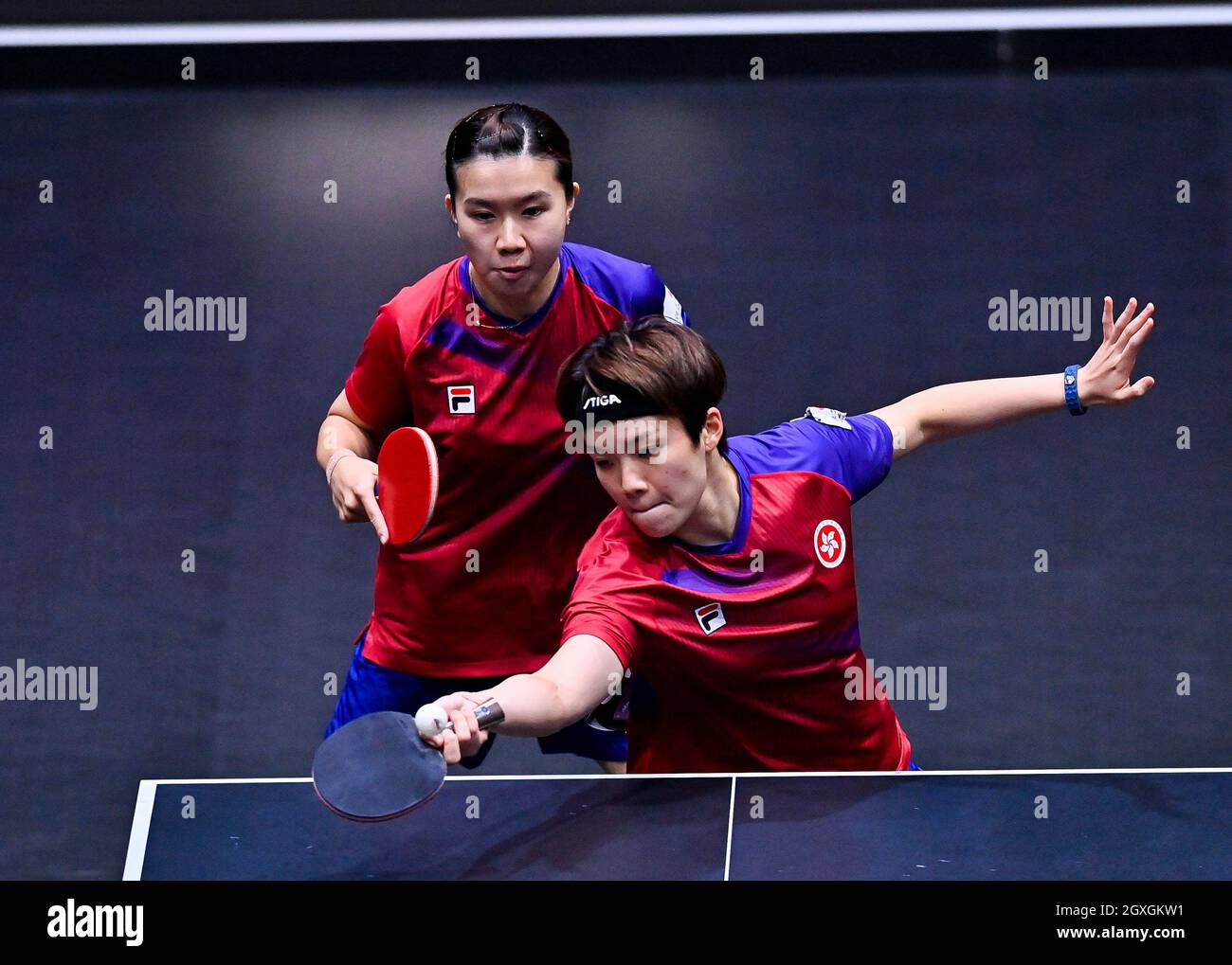 Doha, Qatar. 5th Oct, 2021. Doo Hoi Kem (R) and Lee Ho Ching of China's ...