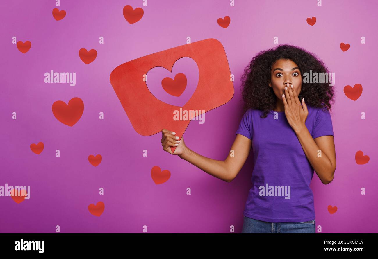 Woman is happy because receives hearts on social network application ...