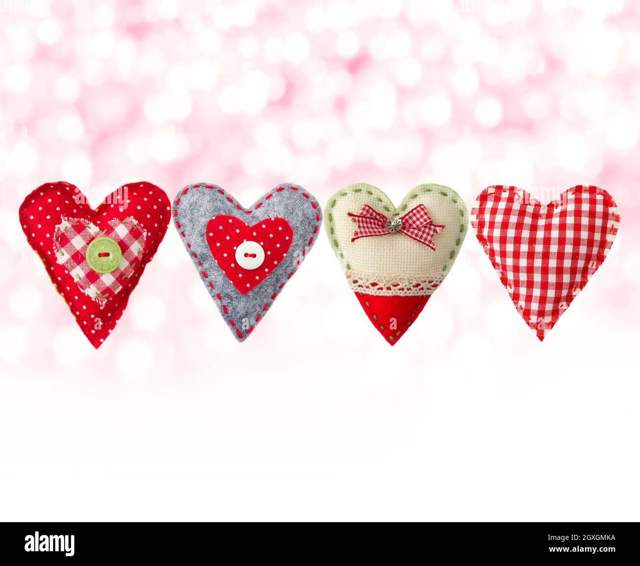 hand made textile hearts. Textile handicraft isolated on white ...