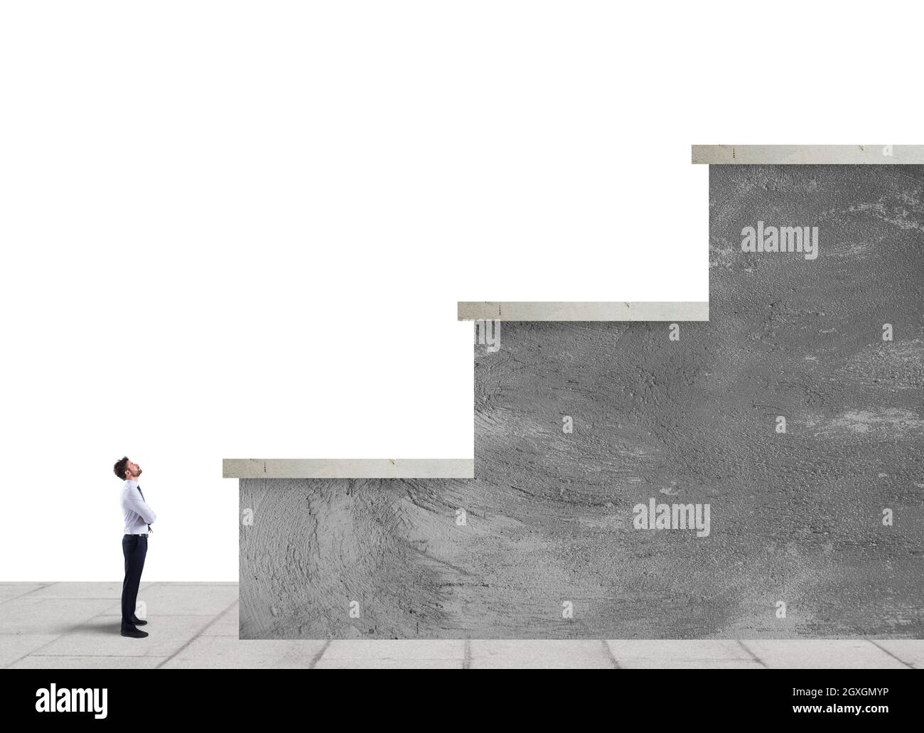 Businessman is small compared to big stairs Stock Photo - Alamy