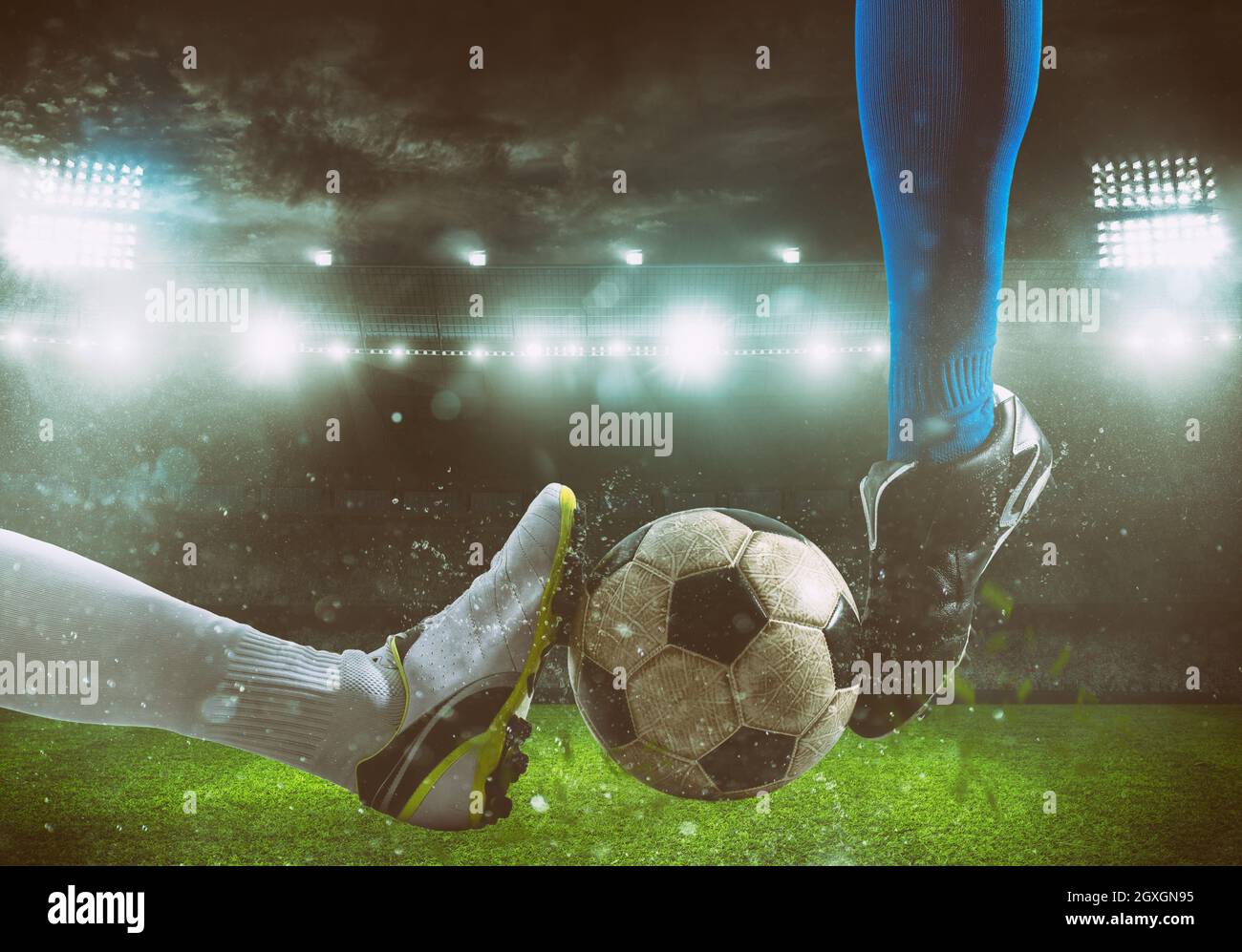 Two soccer players chase the ball at the stadium Stock Photo - Alamy