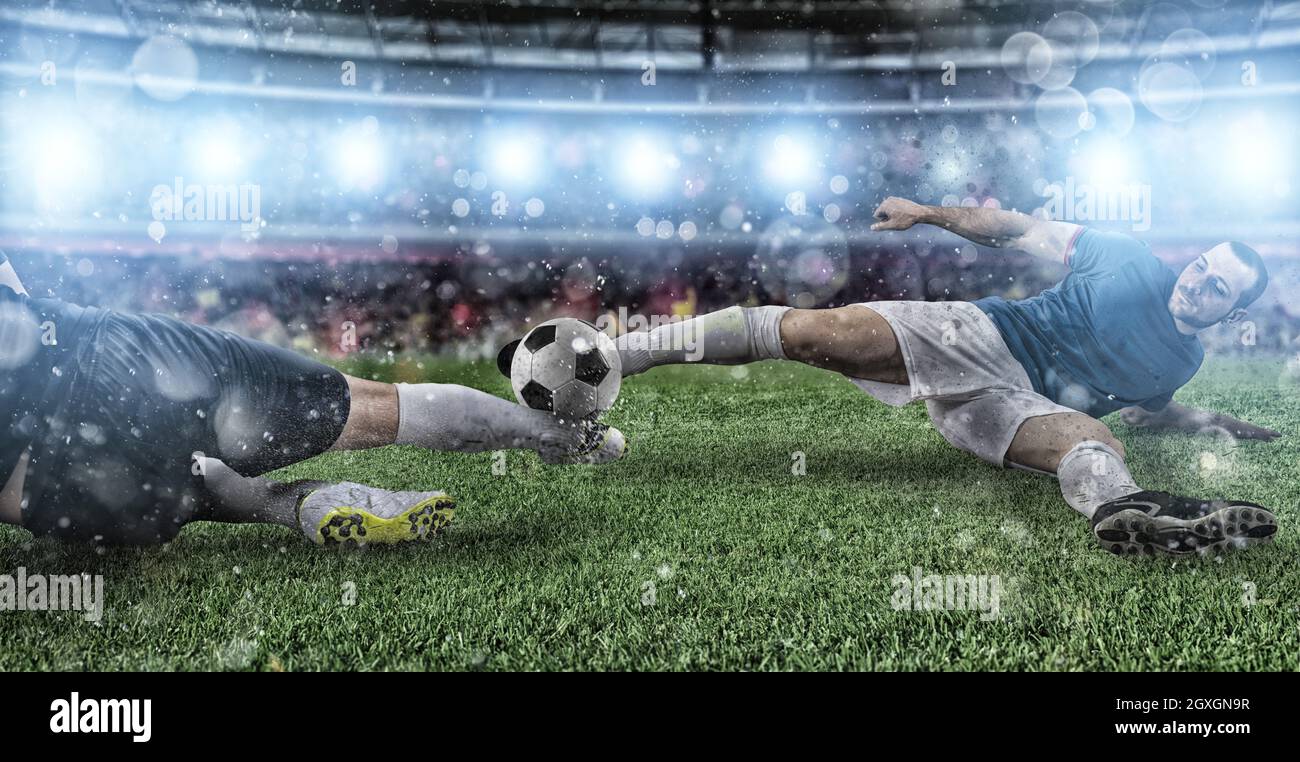 Football action scene with competing football players at the stadium ...