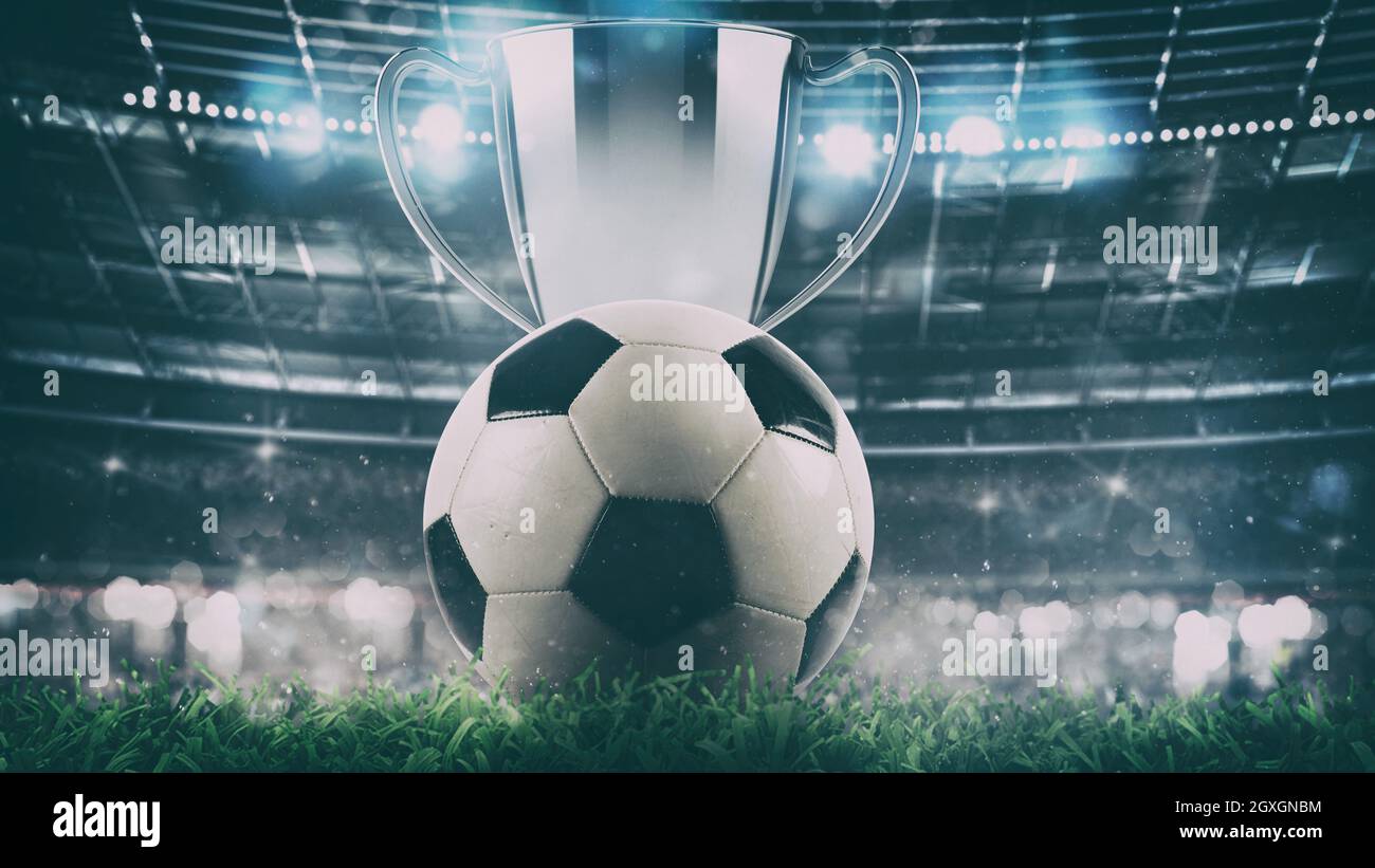 Football scene at night match, ball with trophy Stock Photo - Alamy
