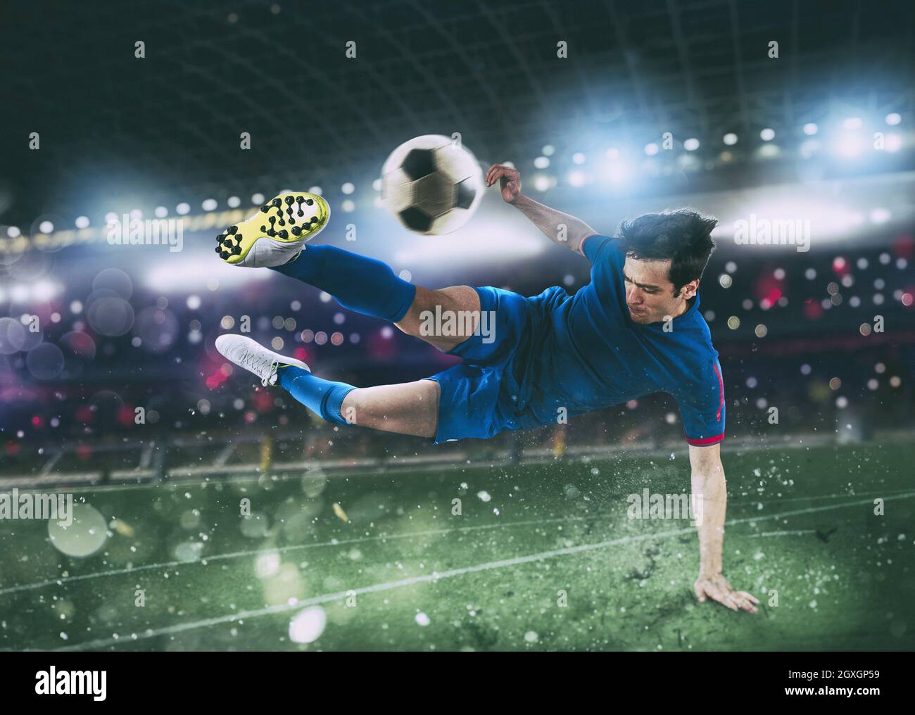 Soccer player kicks the ball vigorously at the stadium Stock Photo - Alamy