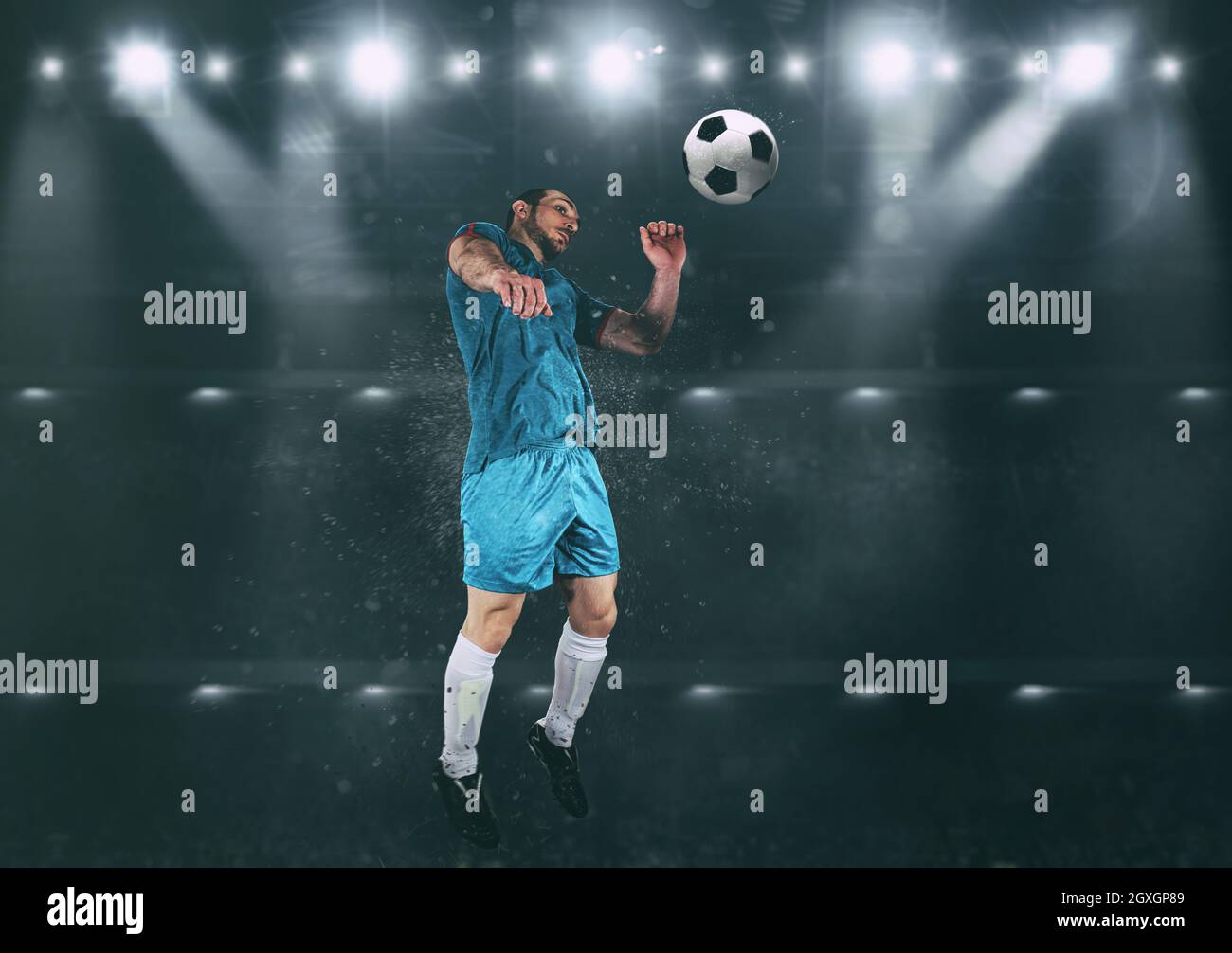Soccer player jumps to hit the ball with head at the stadium Stock ...