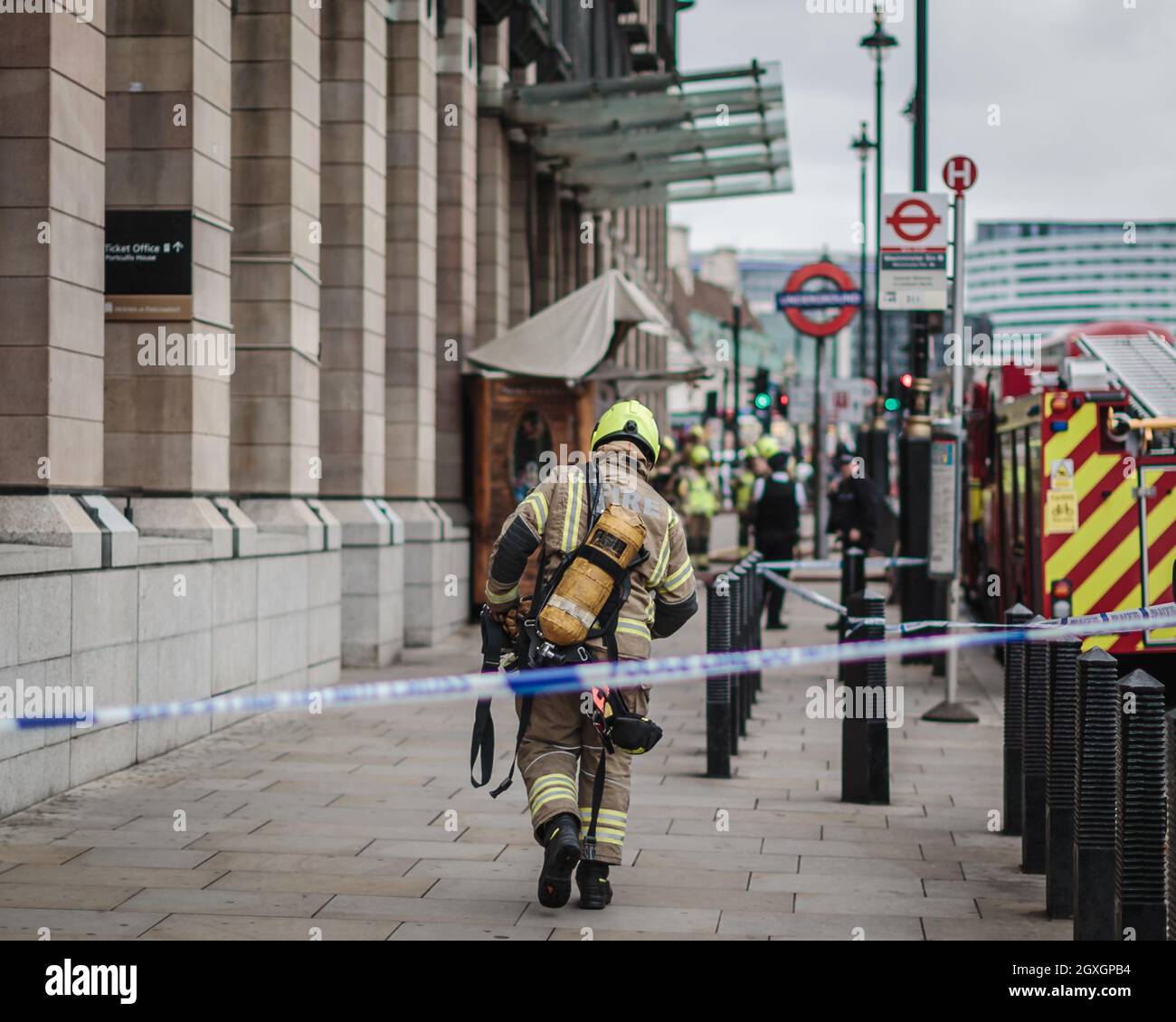 A fire fighter makes his way to Westminster Tube Station after a fire ...