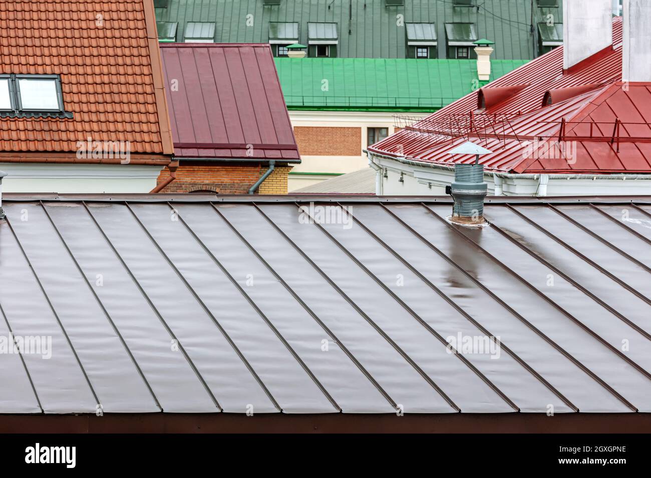 wet rooftops of old traditional classic buildings. viewed from above on ...