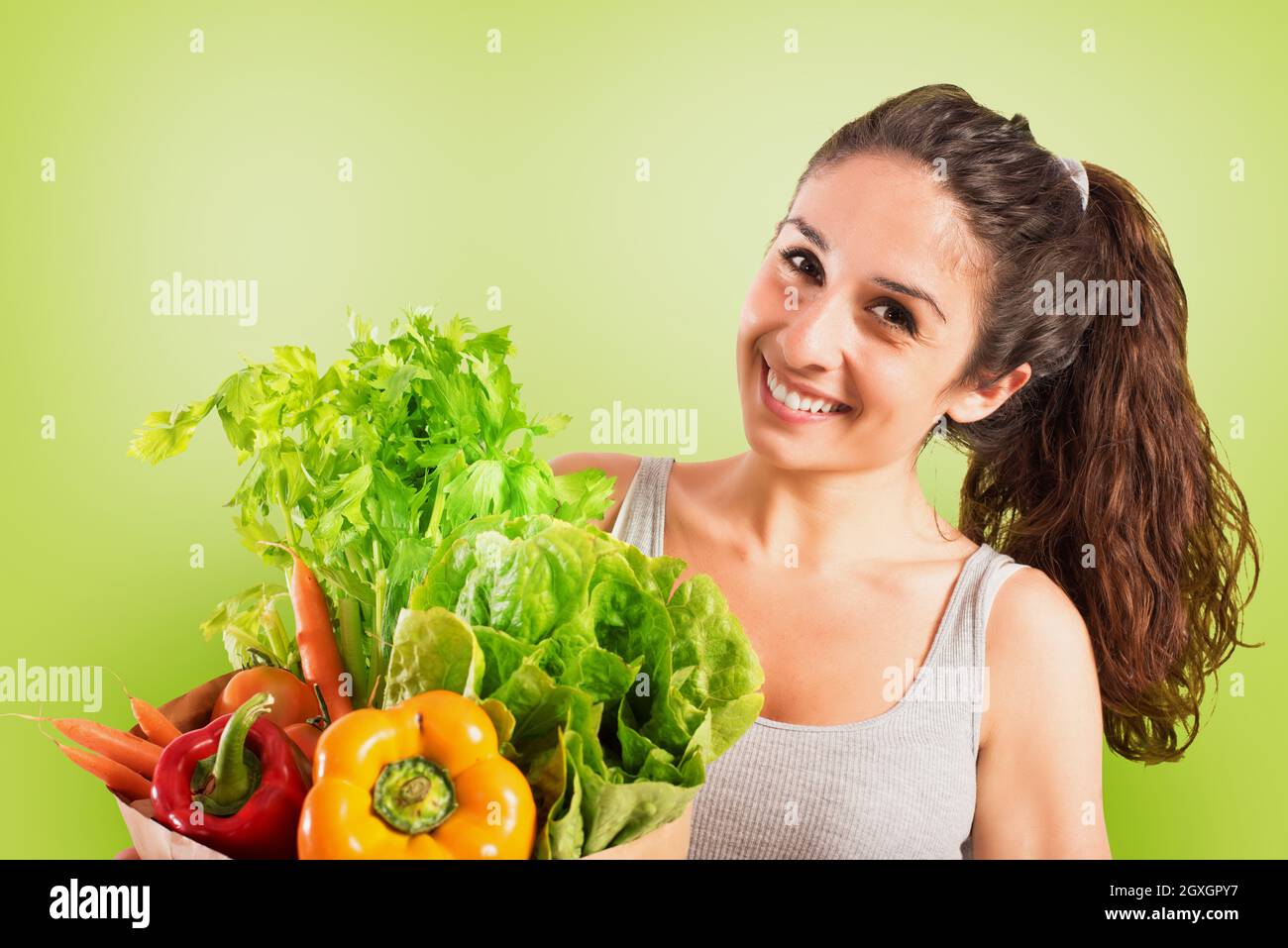 Beautiful girl with vegetables in the bag. Green style concept Stock ...