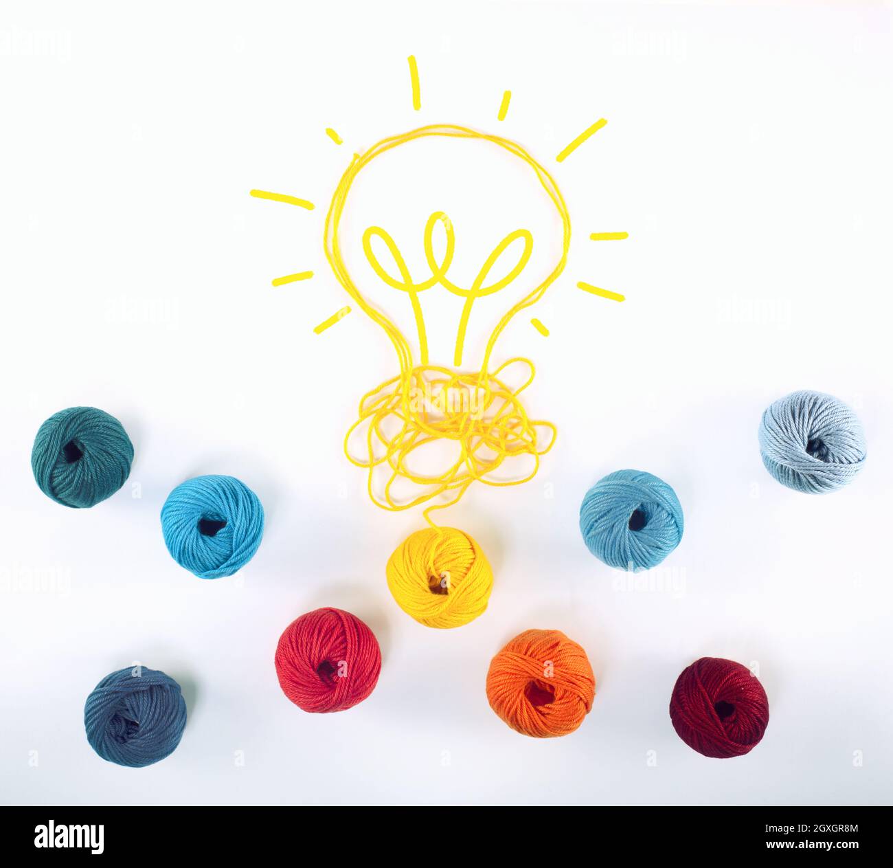 Concept of idea and innovation with tangle of wool yarn that shapes a ...