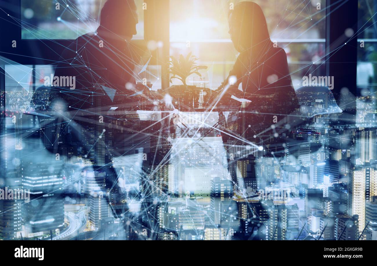 Business people collaborate together in a modern office. Internet ...