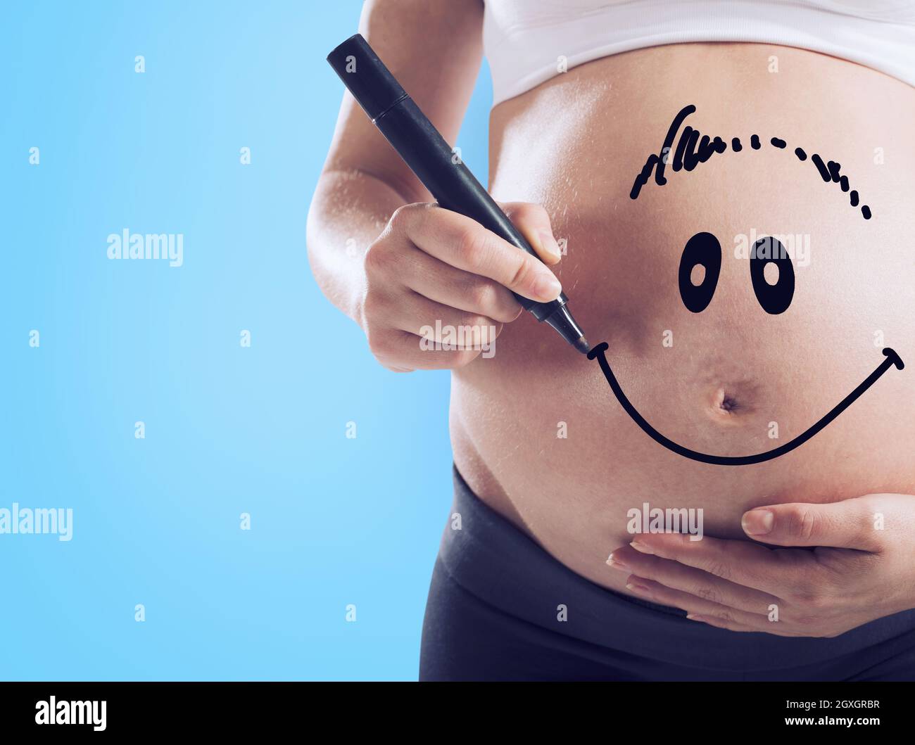 Mummy draws a smile on her stomach Stock Photo - Alamy
