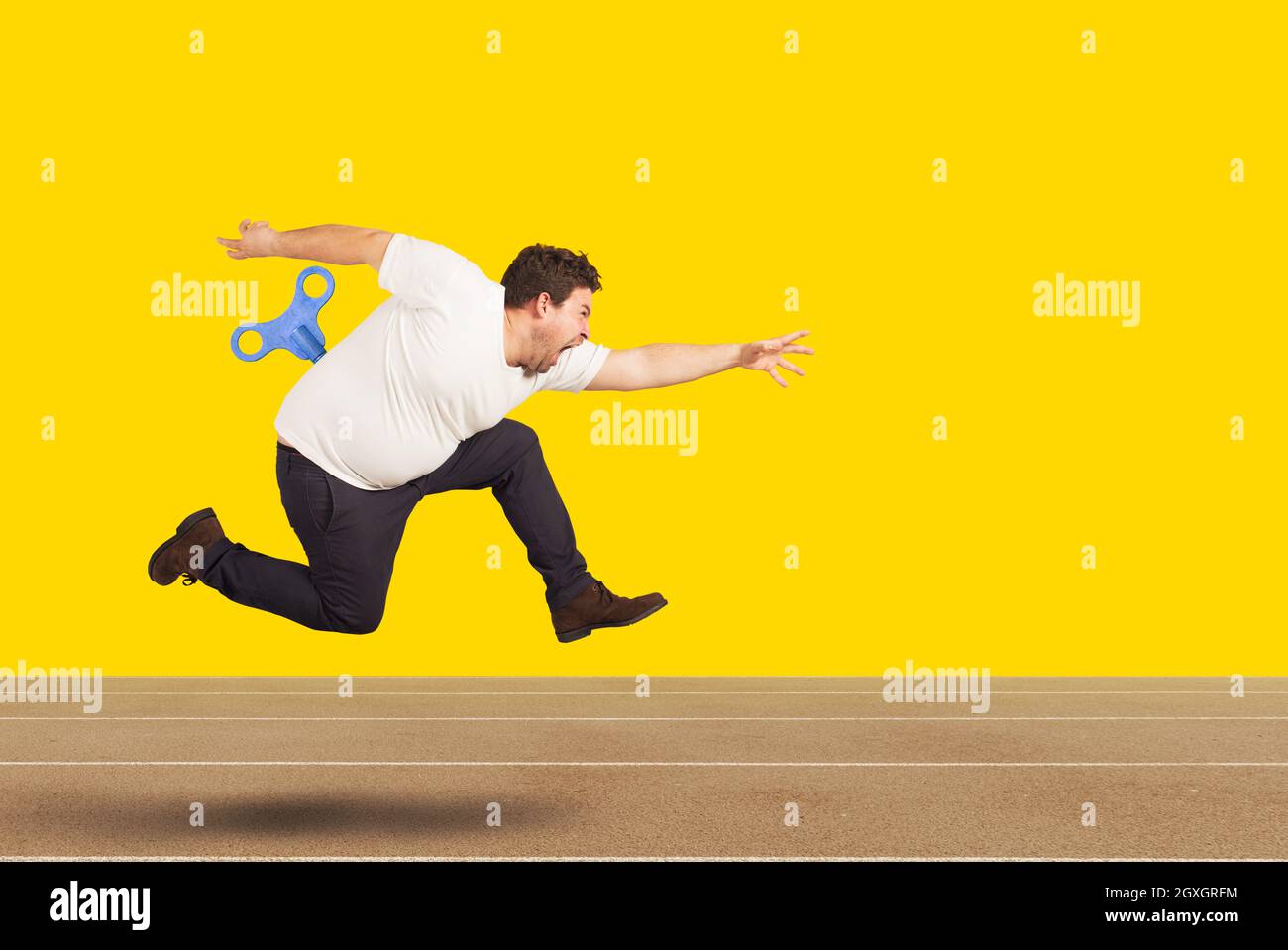 Fat man is running very fast with the help of a charge Stock Photo - Alamy
