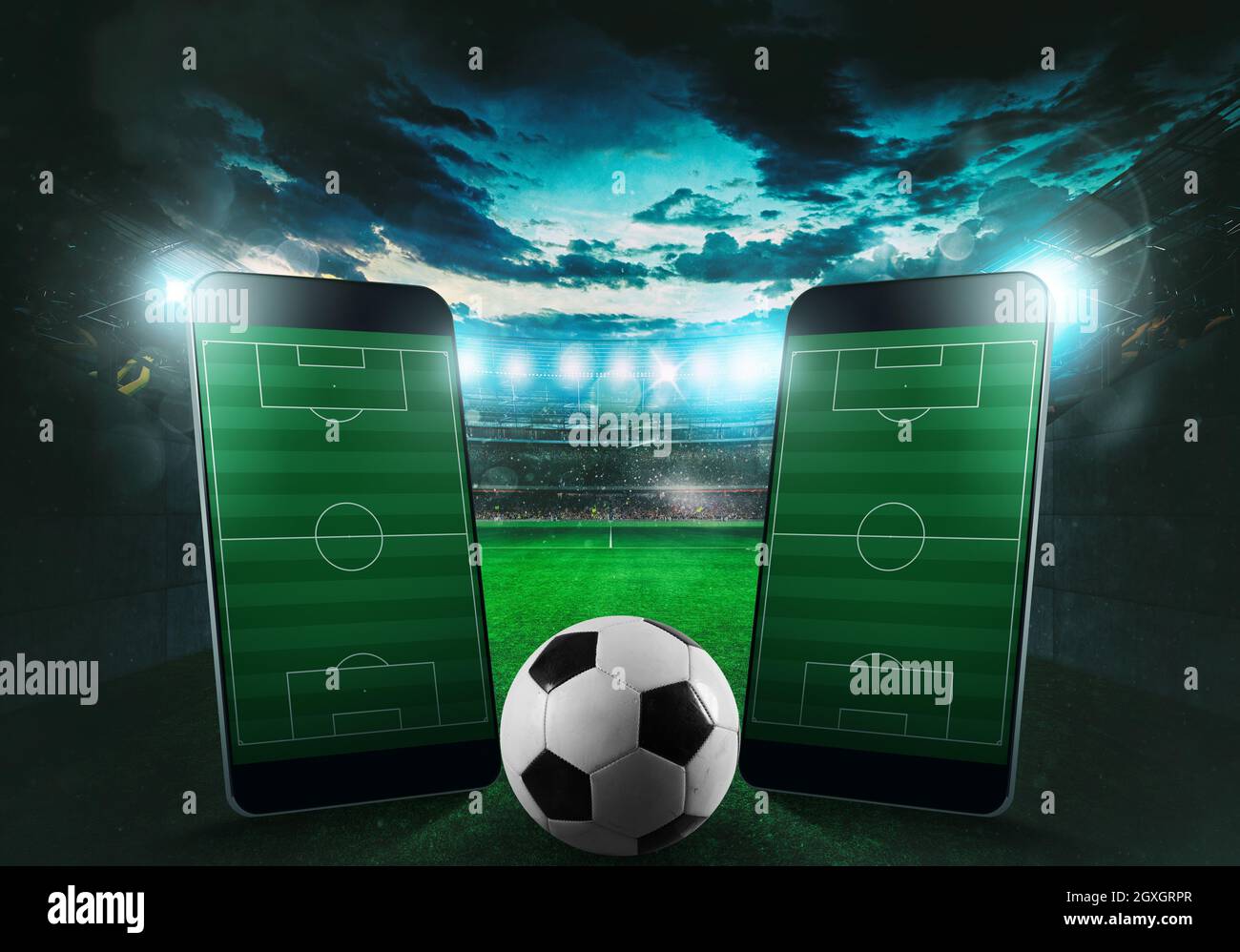 Cellphone and ball with a soccer stadium at the background Stock Photo ...