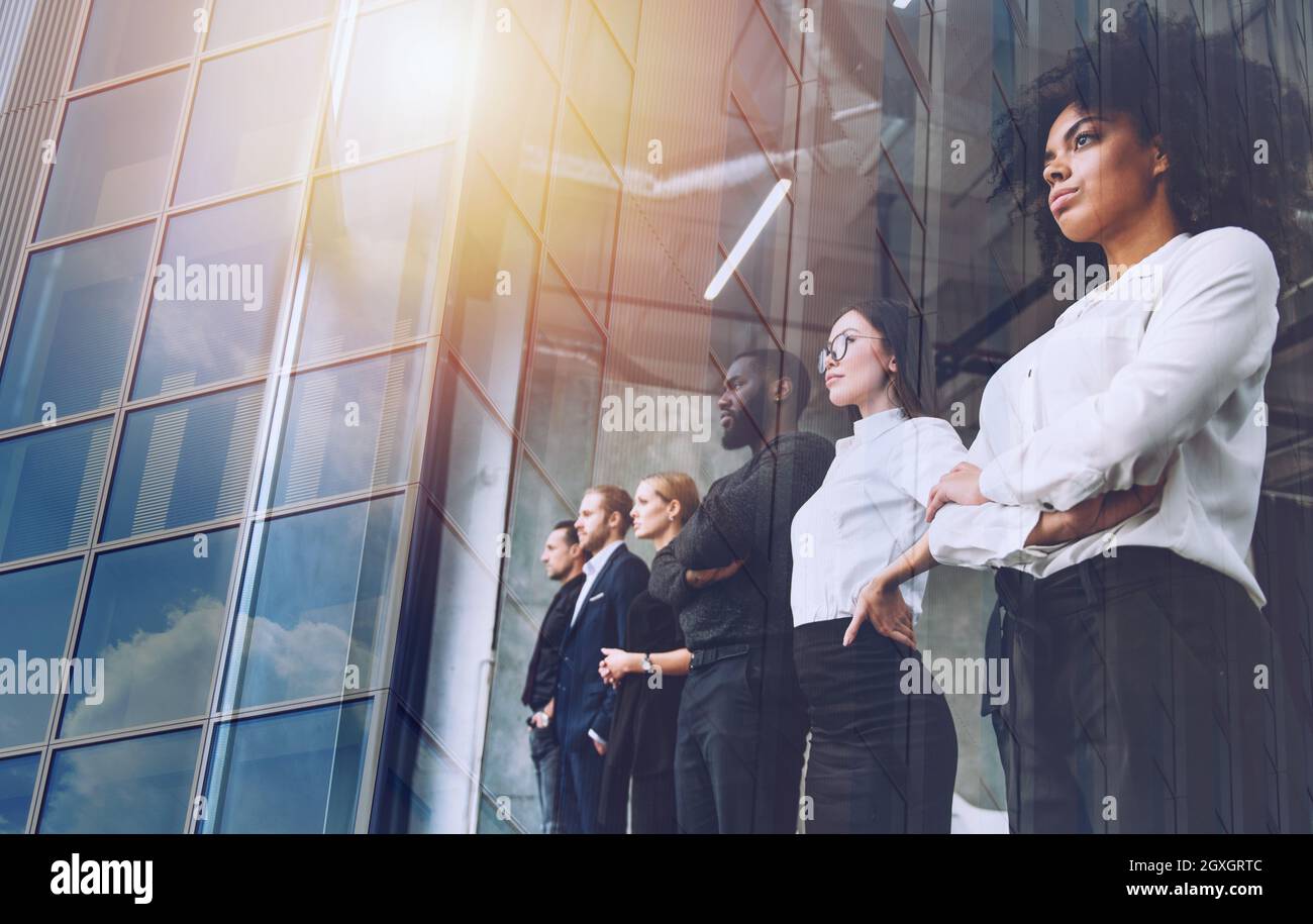 Business people in office in front of window look far. Future vision ...