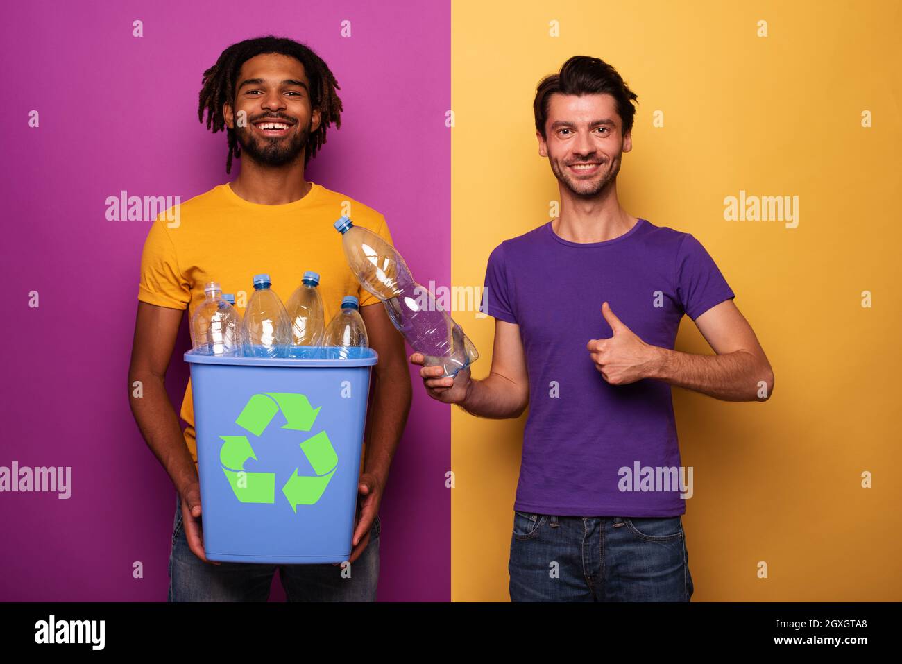 Happy friends hold a plastic container with bottles yellow and purple ...