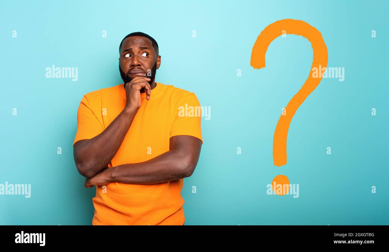 Confuse and pensive expression of a black boy with a big questions ...