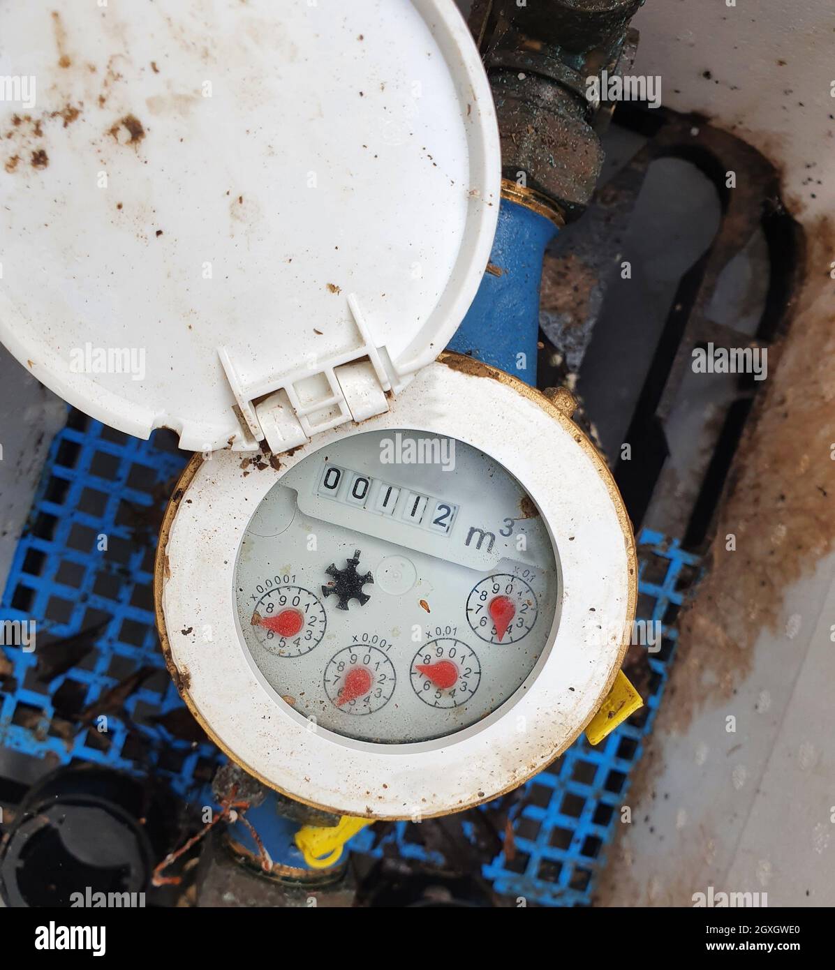 Water meter. Outdoor rusty and dirty water meter for measuring the ...