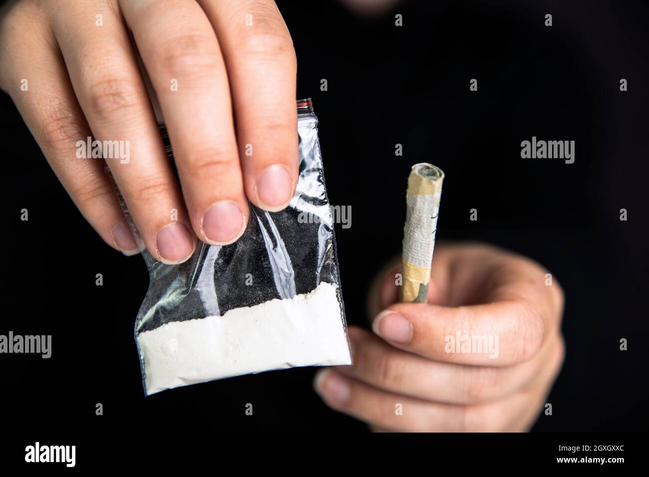 Drug dealer Giving drugs in a plastic bag, cocaine,heroin,speed or ...