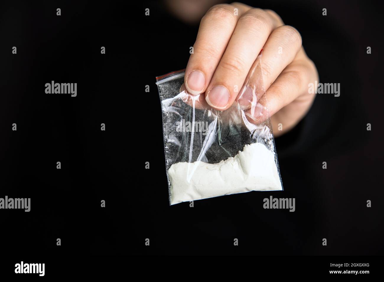 Drug dealer Giving drugs in a plastic bag, cocaine,heroin,speed or ...