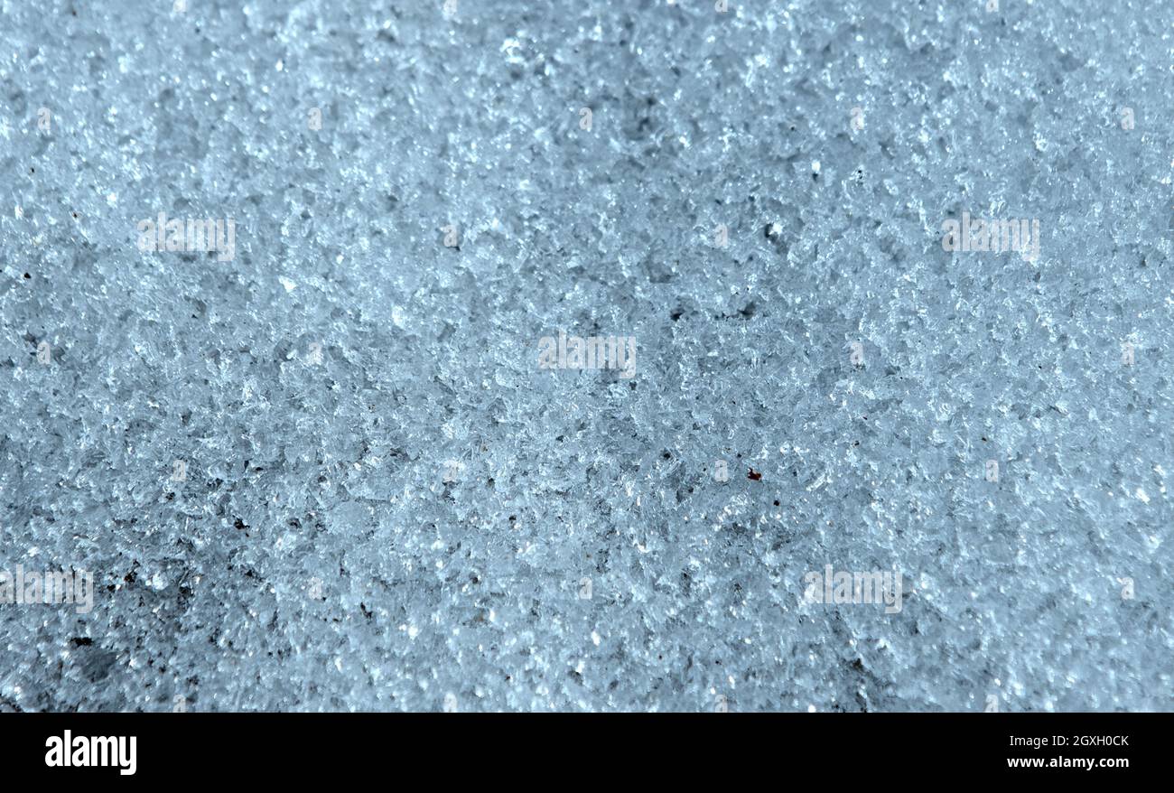 Background texture of icy snow. Grains of ice in the sunlight Stock ...