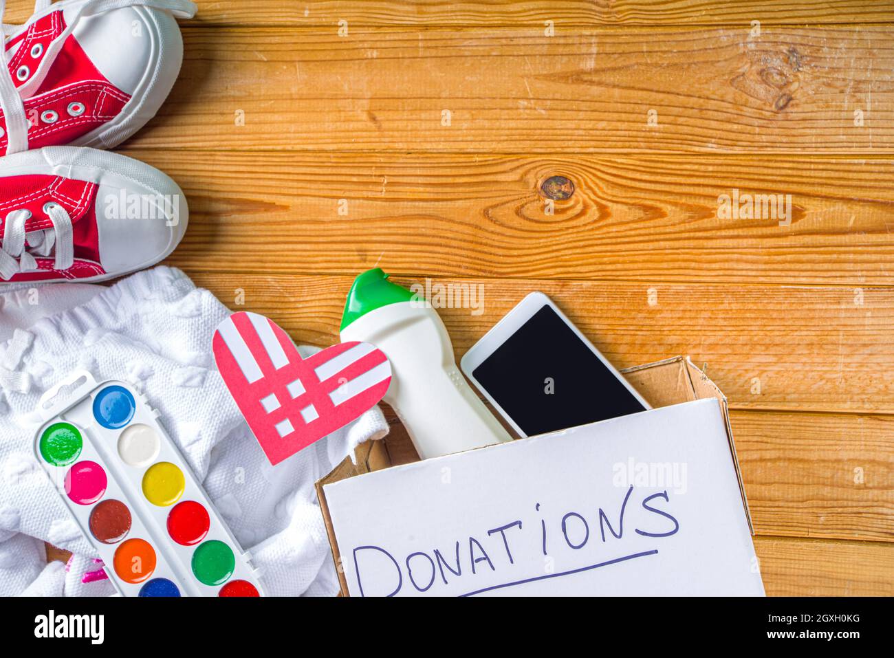Donation Box with various give goods for Giving Tuesday, with red heart ...