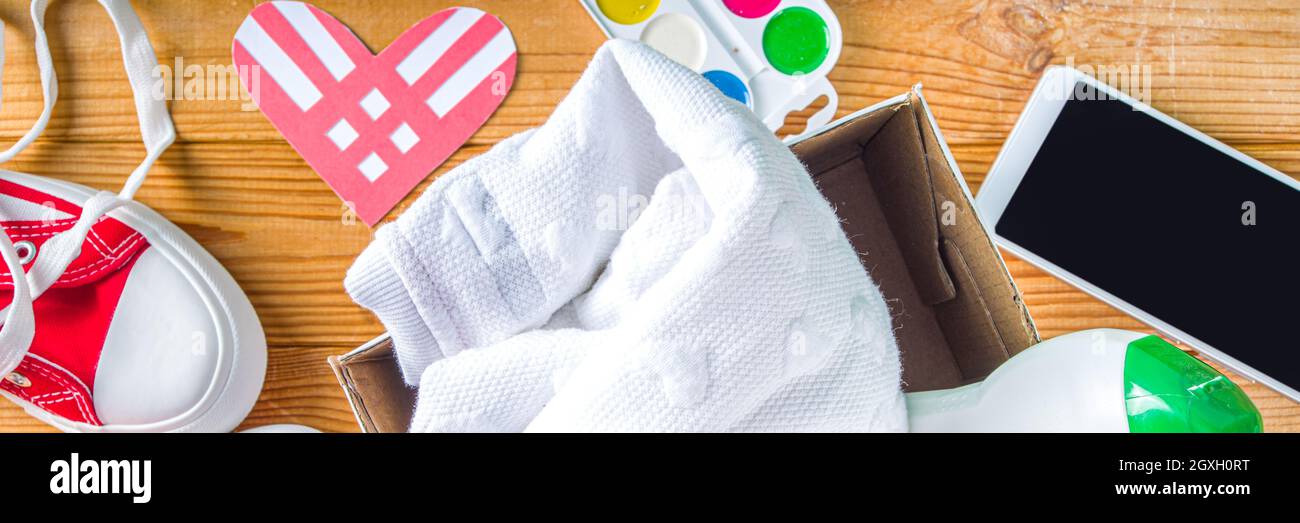 Donation Box with various give goods for Giving Tuesday, with red heart ...