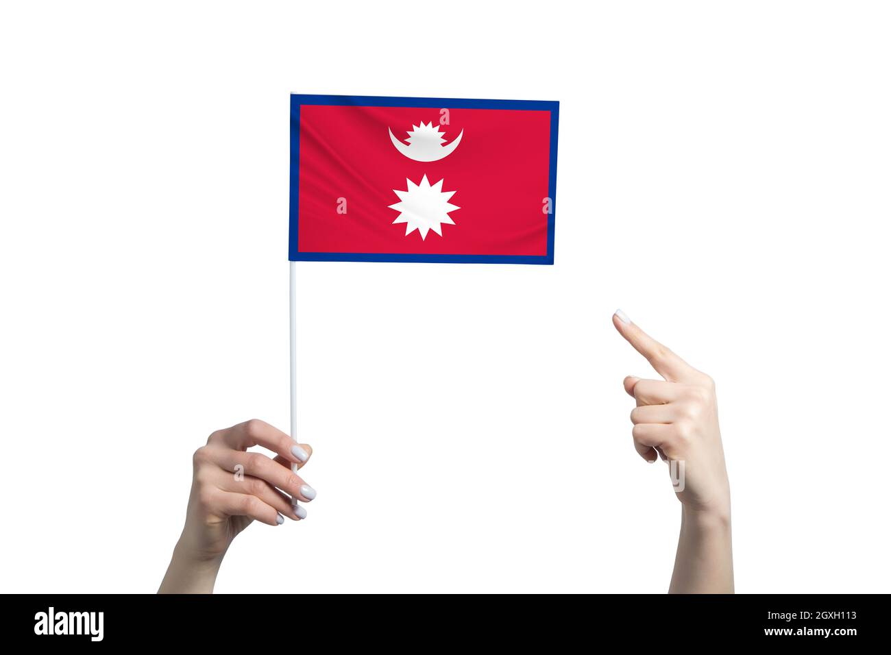 A beautiful female hand holds a Nepal flag to which she shows the ...