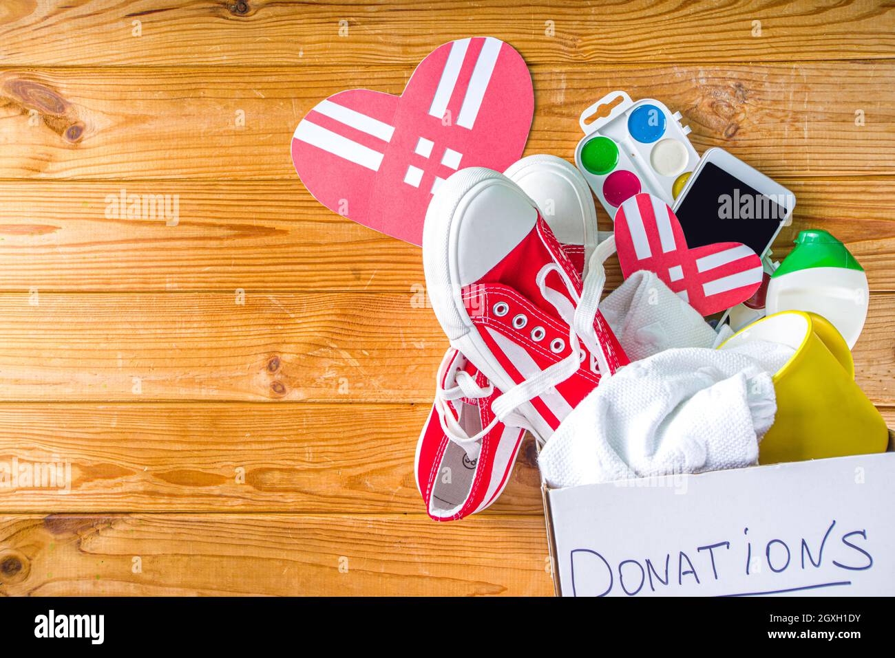 Donation Box with various give goods for Giving Tuesday, with red heart ...