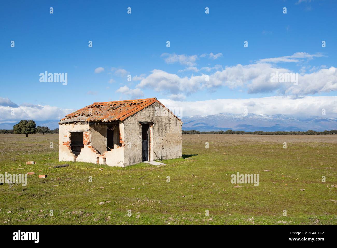 Abandoned and ruined house in the countryside. Stunning clouds in the ...